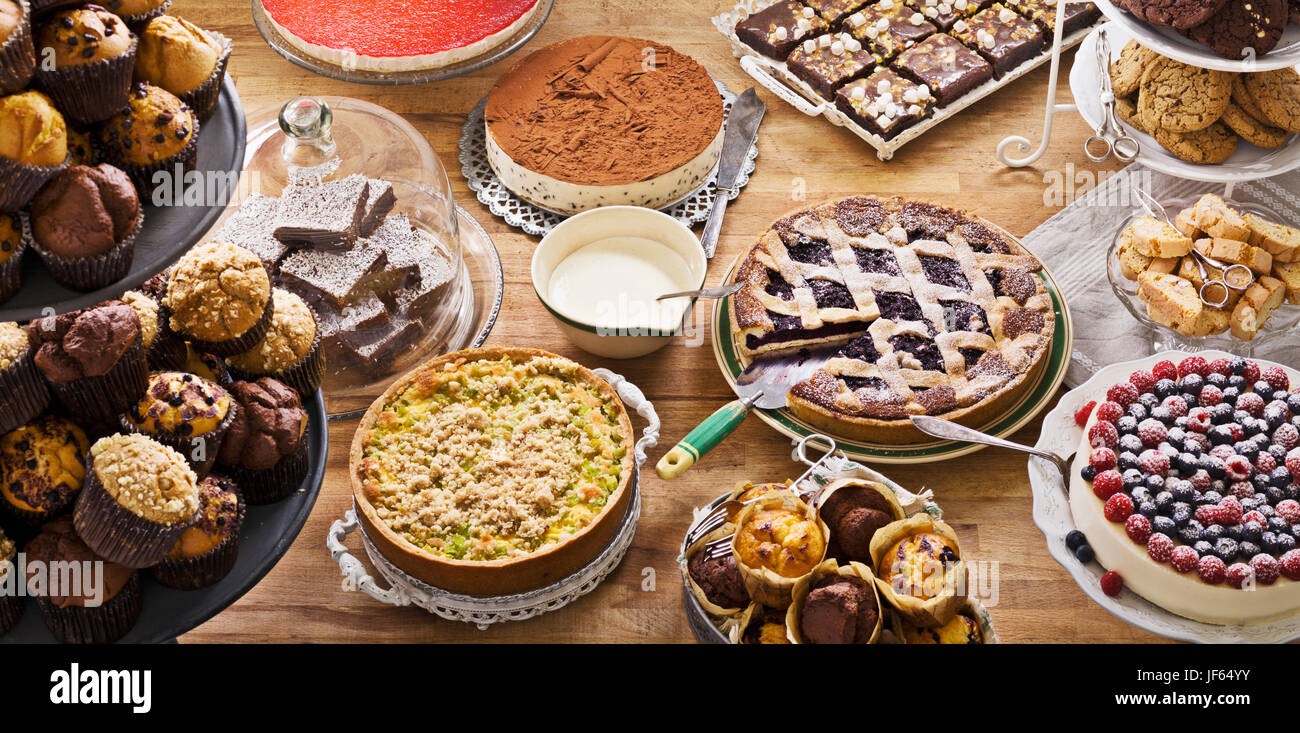 Variety of cakes on table Stock Photo - Alamy