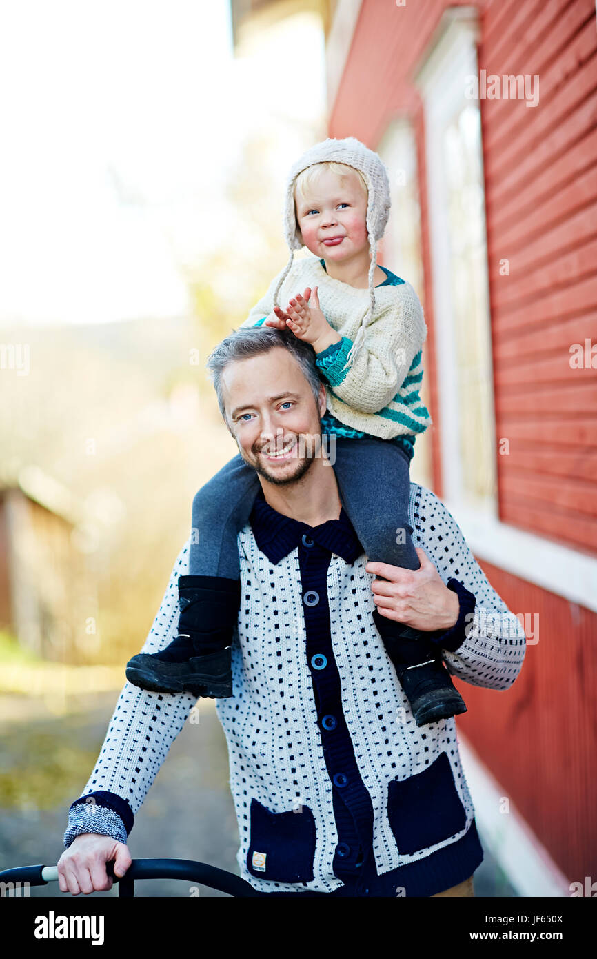 Portrait of father carrying daughter Stock Photo - Alamy