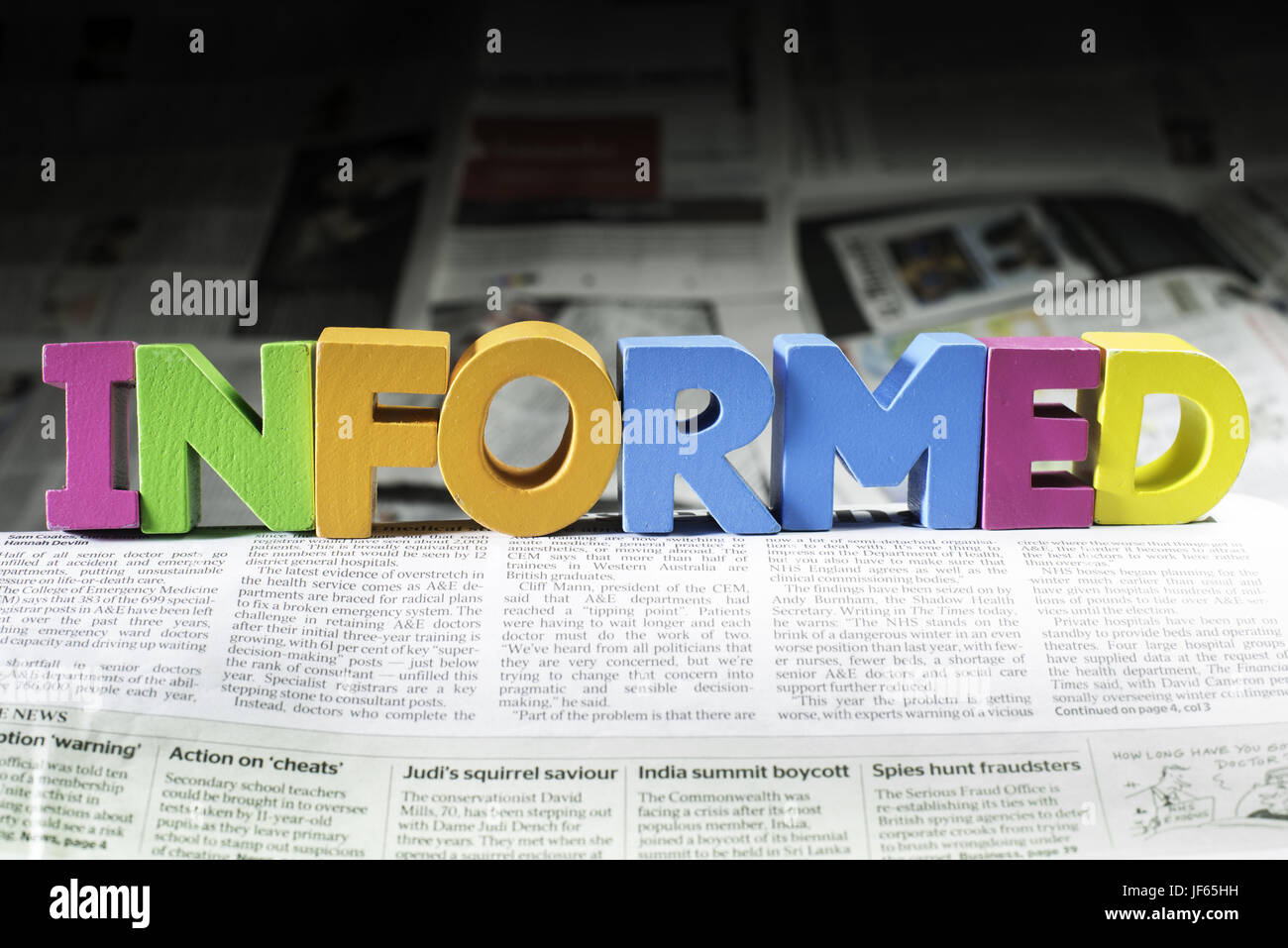 Word informed on newspaper Stock Photo - Alamy