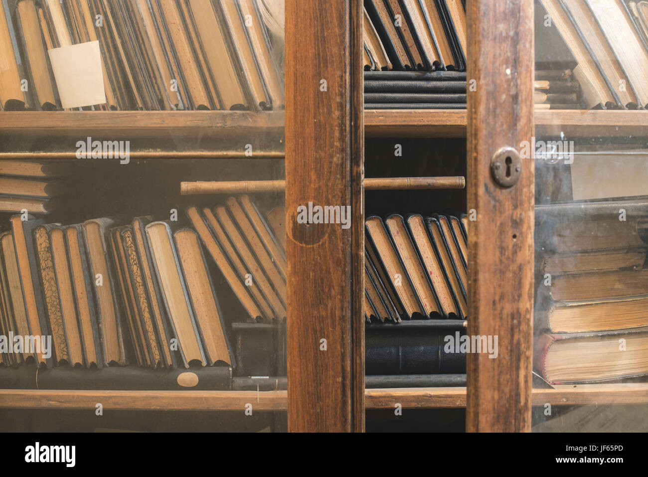 Old books in a vintage library Stock Photo - Alamy