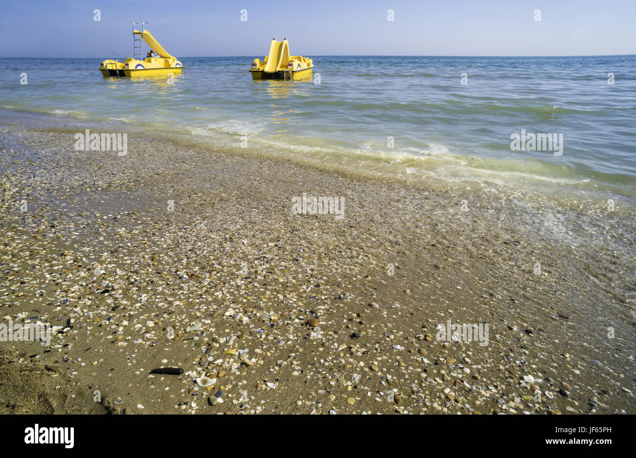 Yellow lifeboat on the beach Stock Photo - Alamy