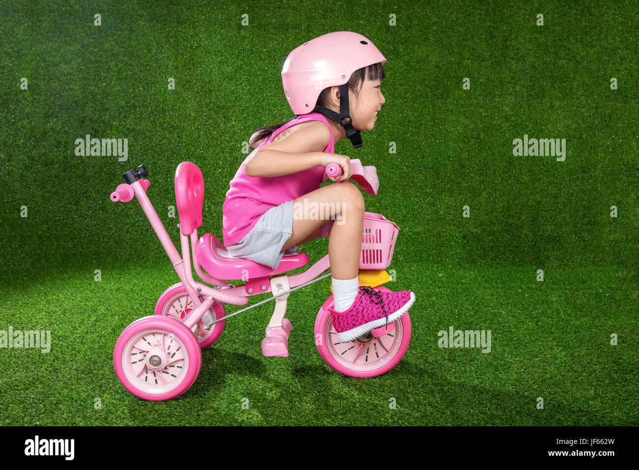Asian Chinese little girl riding bicycle at outdoor park Stock Photo ...