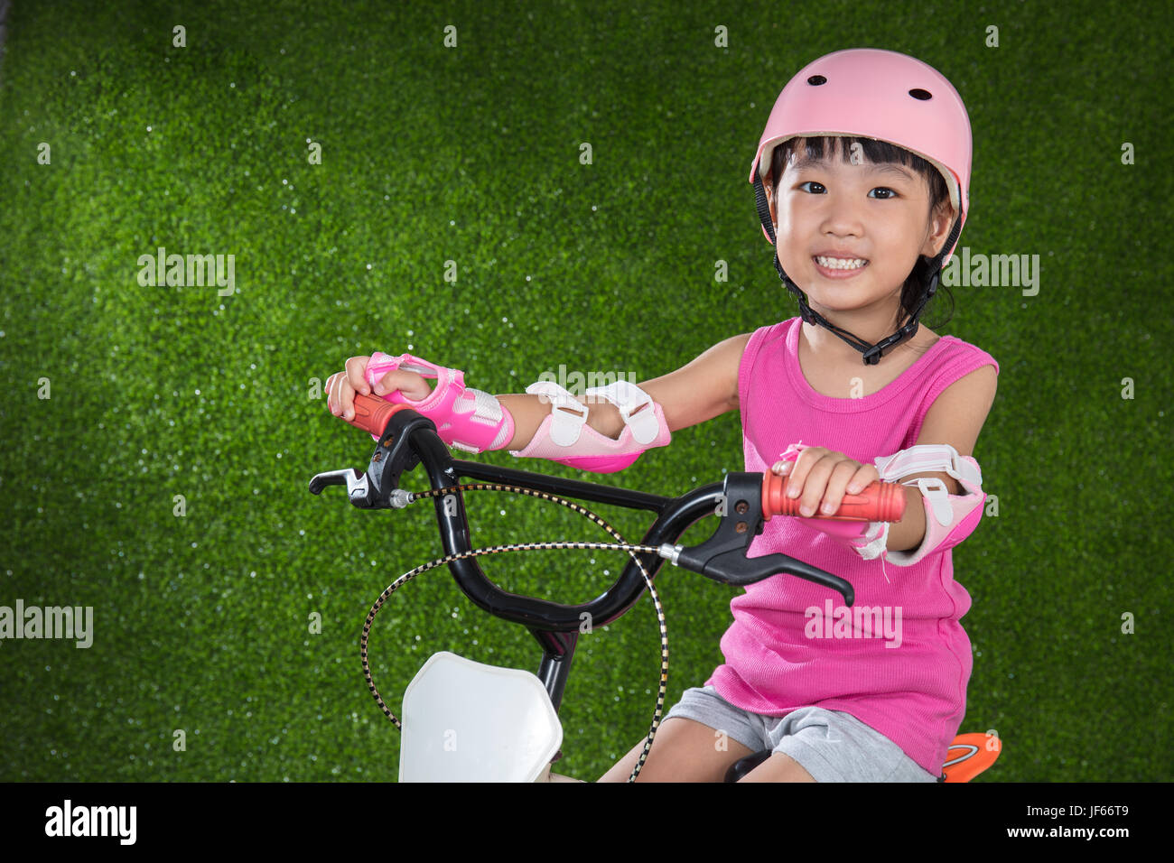 Asian Chinese little girl riding bicycle at outdoor park Stock Photo ...