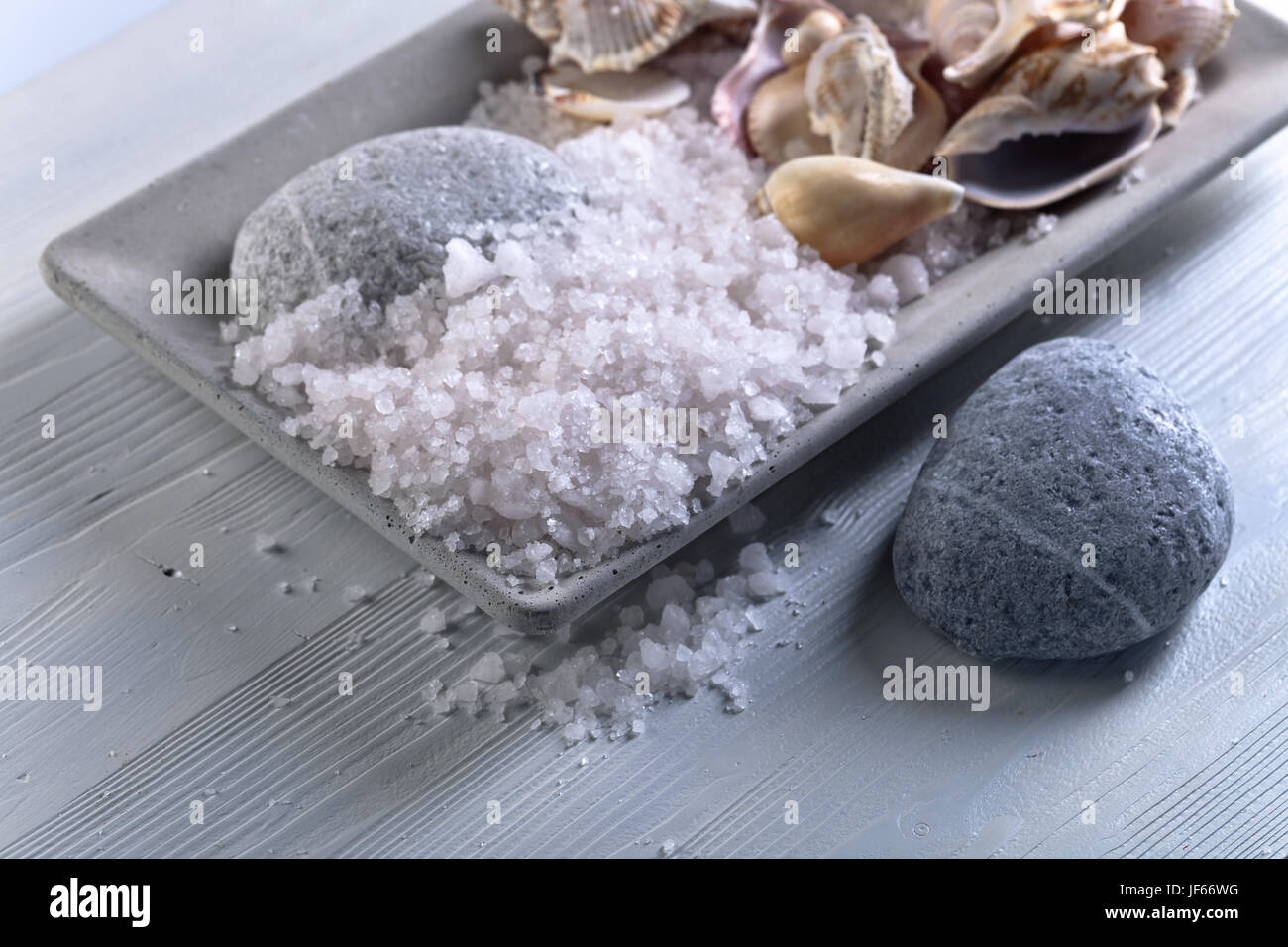 Sea salt on a old wooden table with stones and shells Stock Photo - Alamy