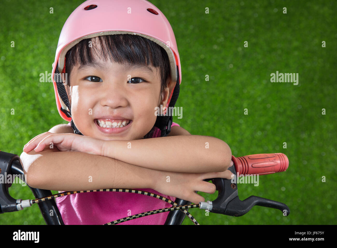 Asian Chinese little girl riding bicycle at outdoor park Stock Photo ...