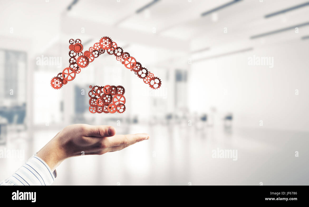 Hand of businessman showing house or home gear sign in palm Stock Photo ...