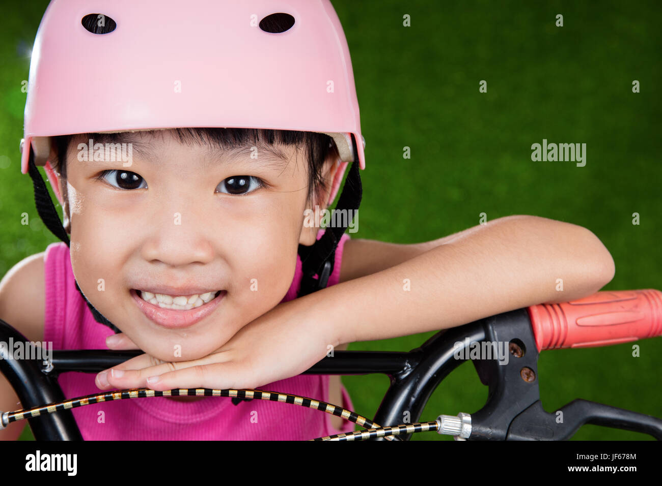 Asian Chinese little girl riding bicycle at outdoor park Stock Photo ...
