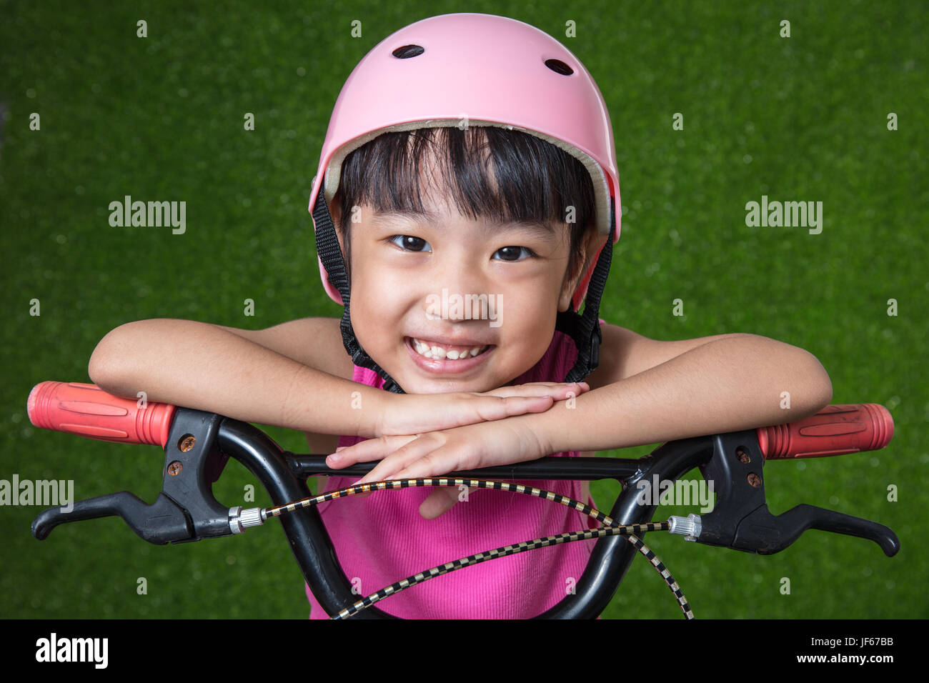 Asian Chinese little girl riding bicycle at outdoor park Stock Photo ...