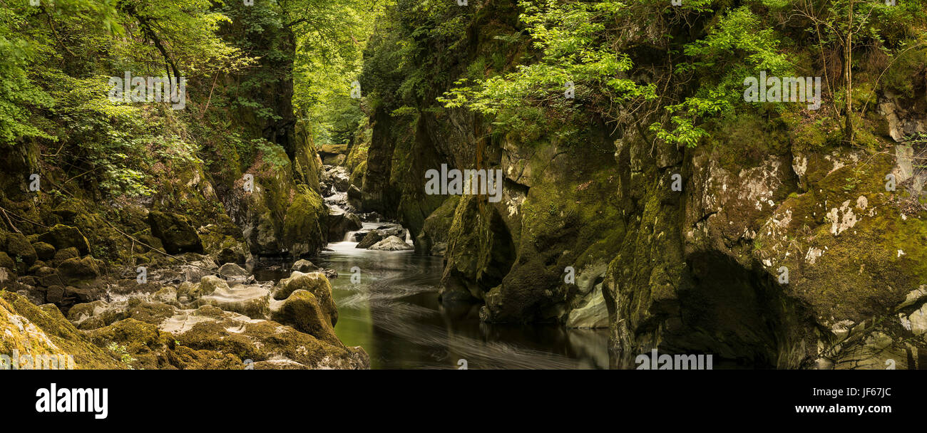 Beautiful panoramic landscape with river flowing through deep sided ...