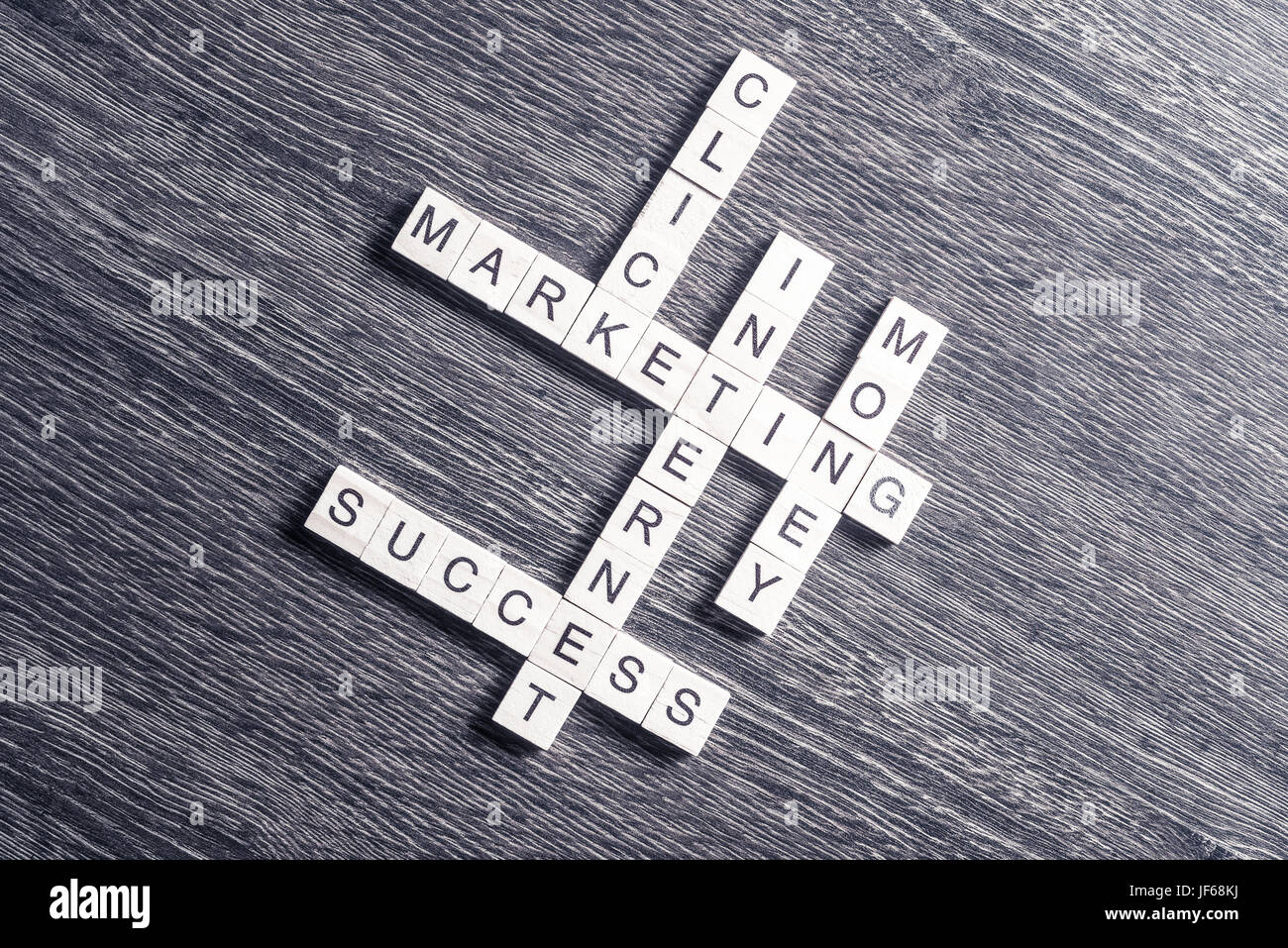 Words of business concepts collected in crossword with wooden cubes ...
