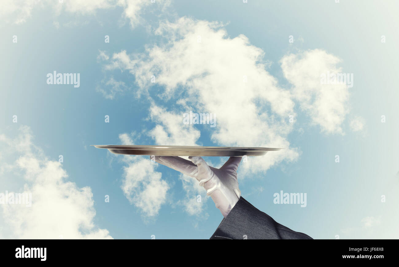 Butler hand in white glove presenting empty tray Stock Photo - Alamy