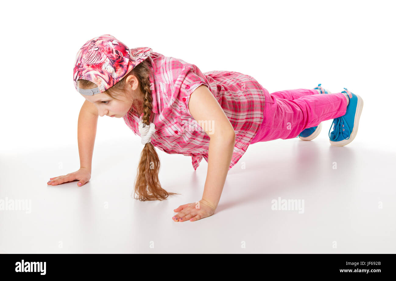 Girl doing push-ups. Isolated on a white background Stock Photo - Alamy