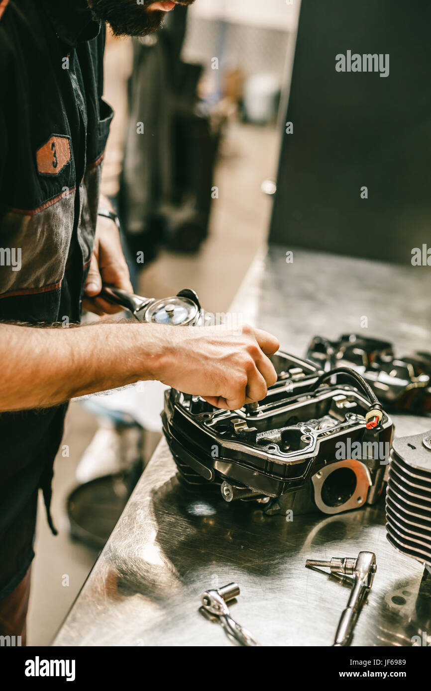 Mechanic fixing custom motorcycle hi-res stock photography and images ...