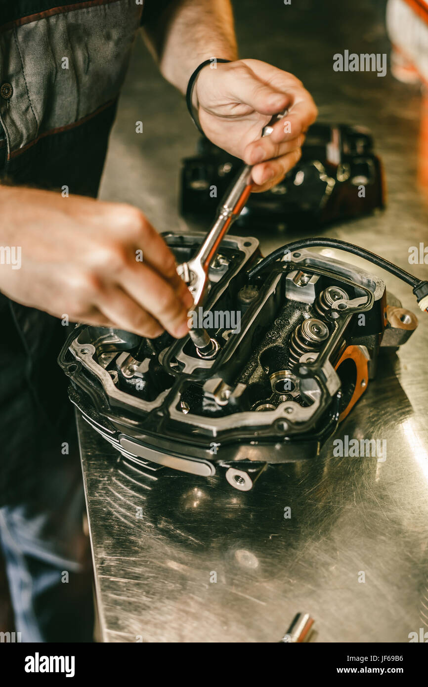 Repairing engine with hands hi-res stock photography and images - Alamy