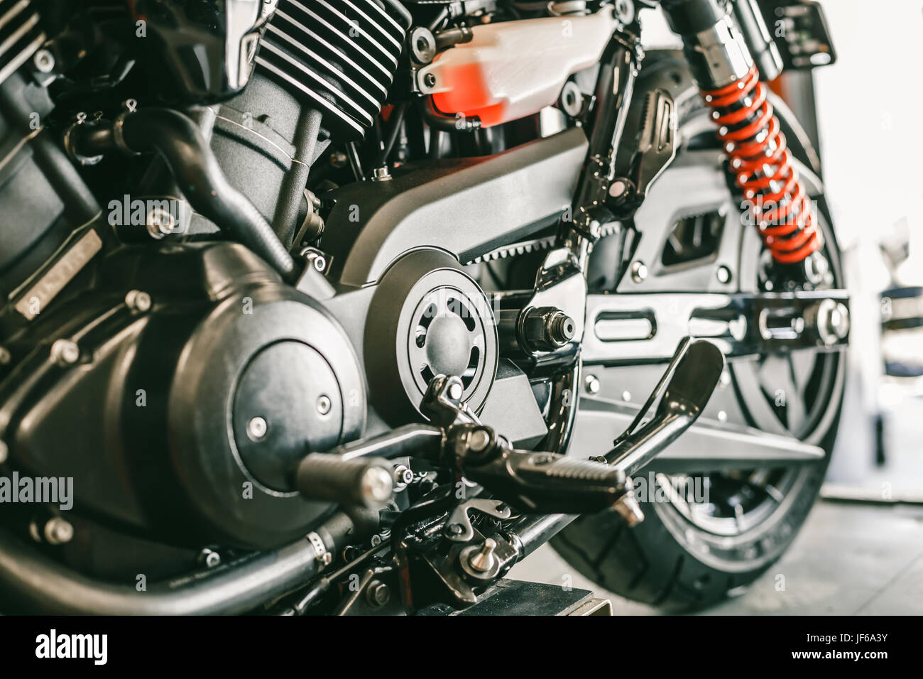 Close up side view of the motorcycle on the lift at the service station ...
