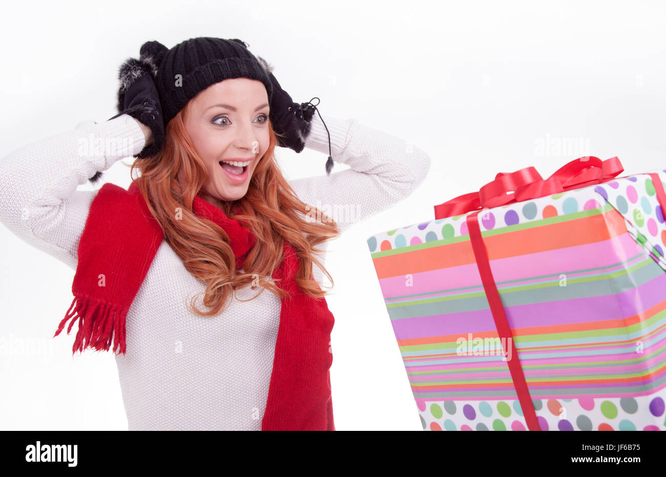 Woman surprised at receiving a gift Stock Photo - Alamy