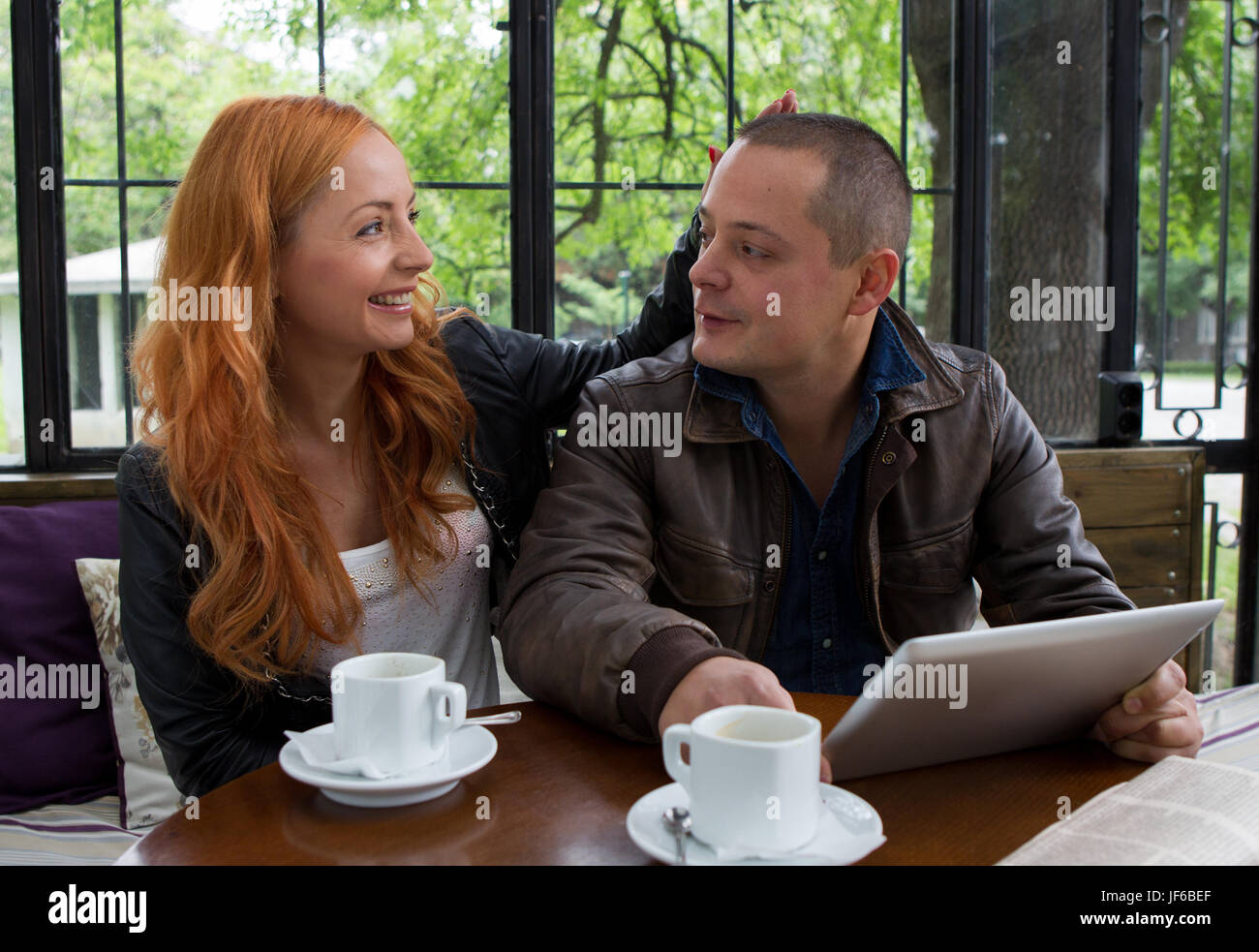 Two students drinking coffee Stock Photo - Alamy