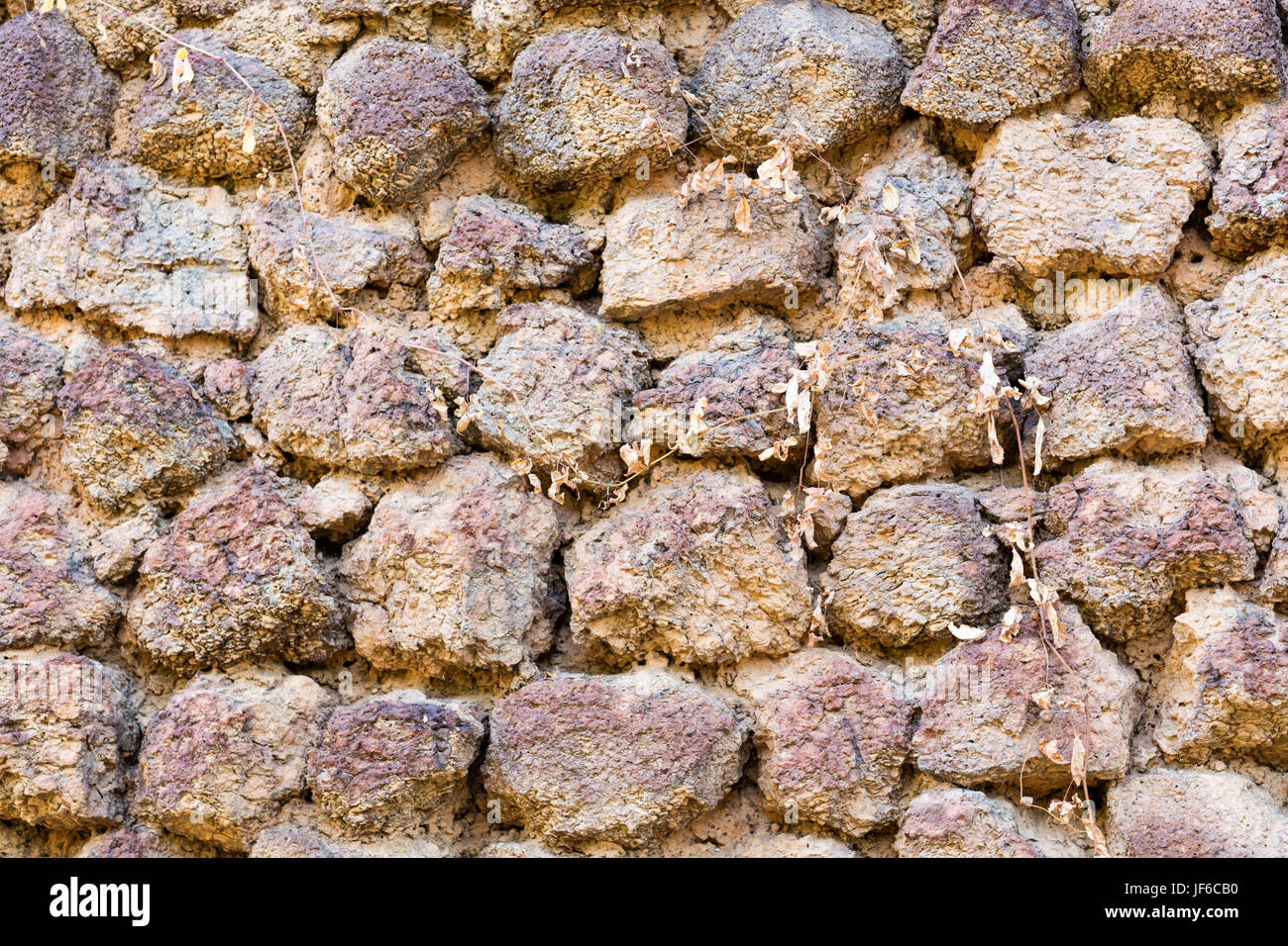 wall of brick, tuff and stone Stock Photo - Alamy