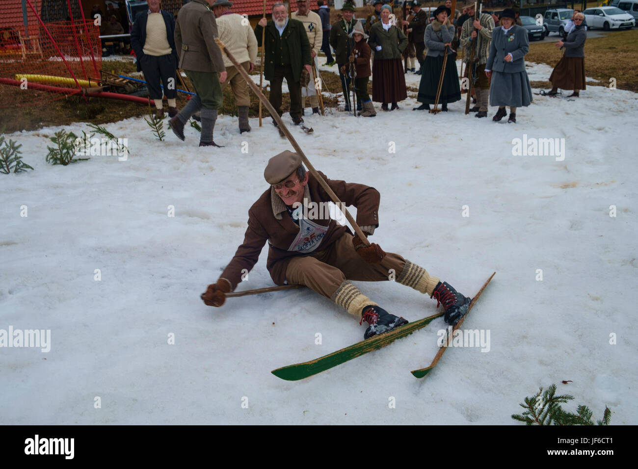 Skiers in traditional retro style costumes, with old wooden ski gear at ...
