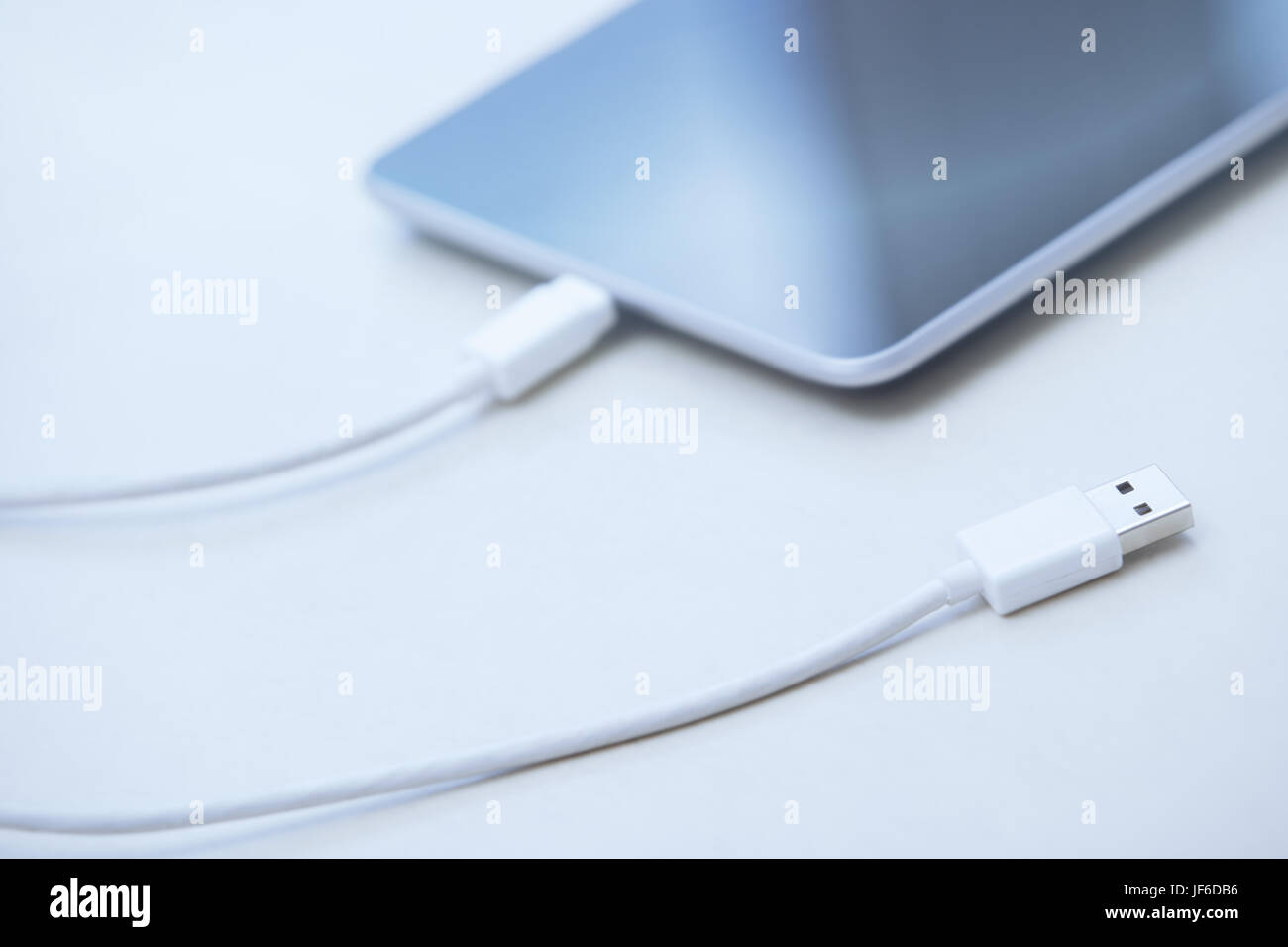 Tablet computer with USB cable Stock Photo - Alamy