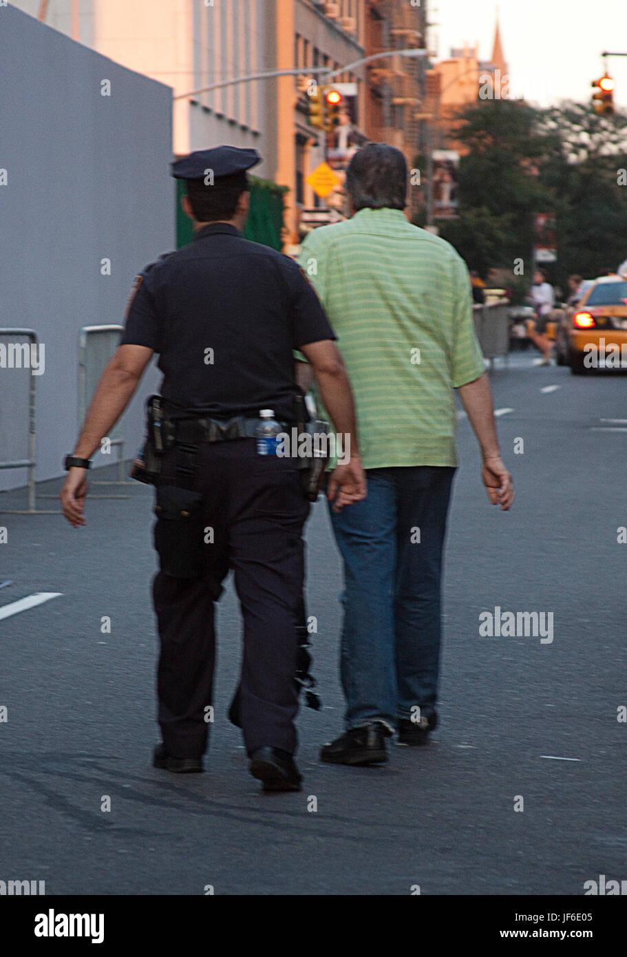 A police officer escorting a citizen Stock Photo - Alamy