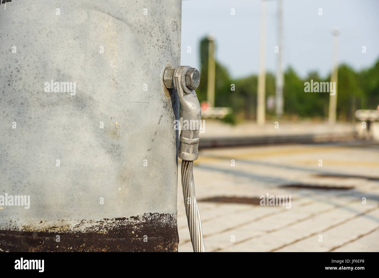 Structural detail of a lighting post steel base plate. Safety ground ...