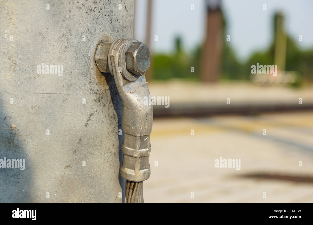 Structural detail of a lighting post steel base plate. Safety ground ...