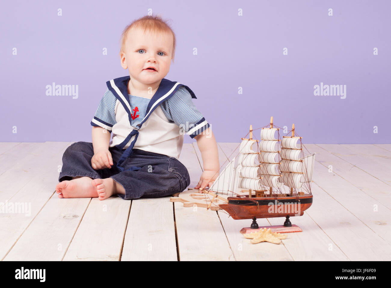 a little boy dressed as a sailor captain of ship Stock Photo - Alamy