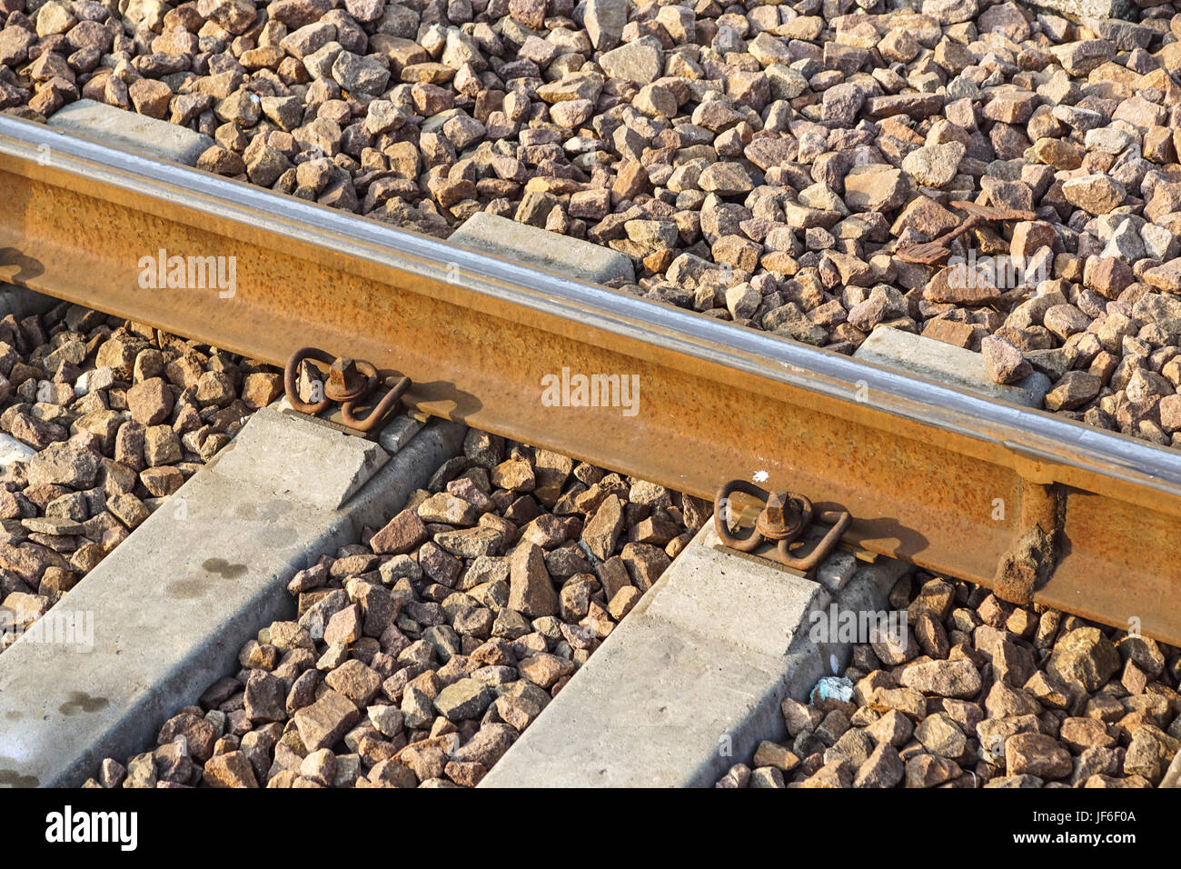 iron rusty train railway detail over dark stones rail way Stock Photo ...