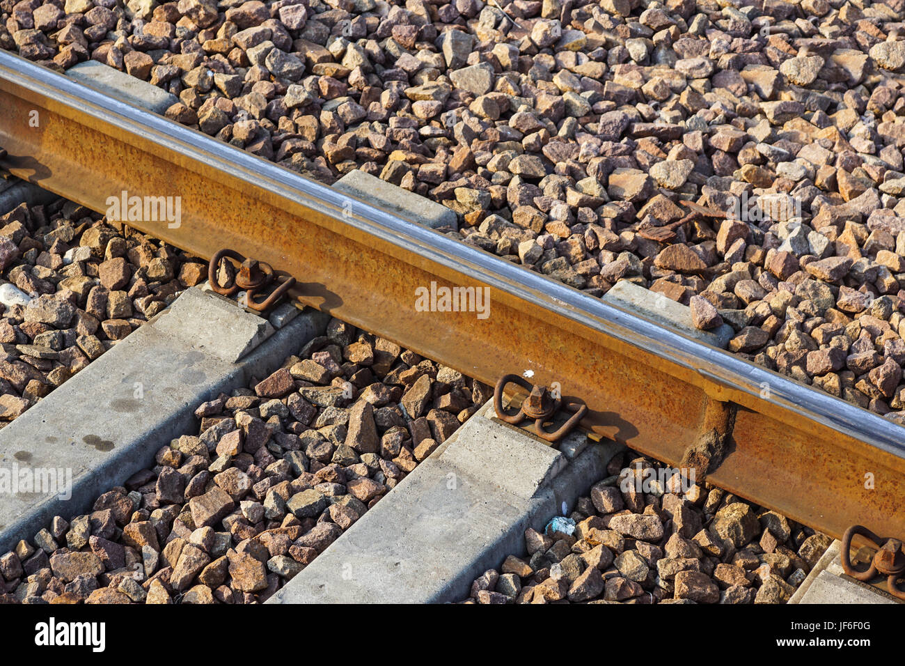 iron rusty train railway detail over dark stones rail way Stock Photo ...