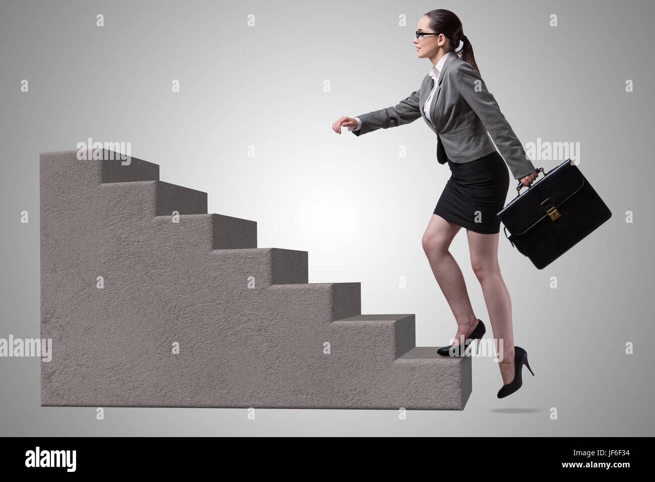 Businesswoman climbing career ladder concept Stock Photo - Alamy
