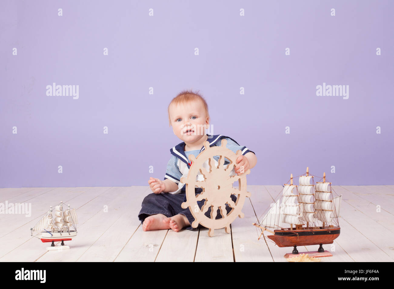 a little boy dressed as a sailor captain of ship Stock Photo - Alamy