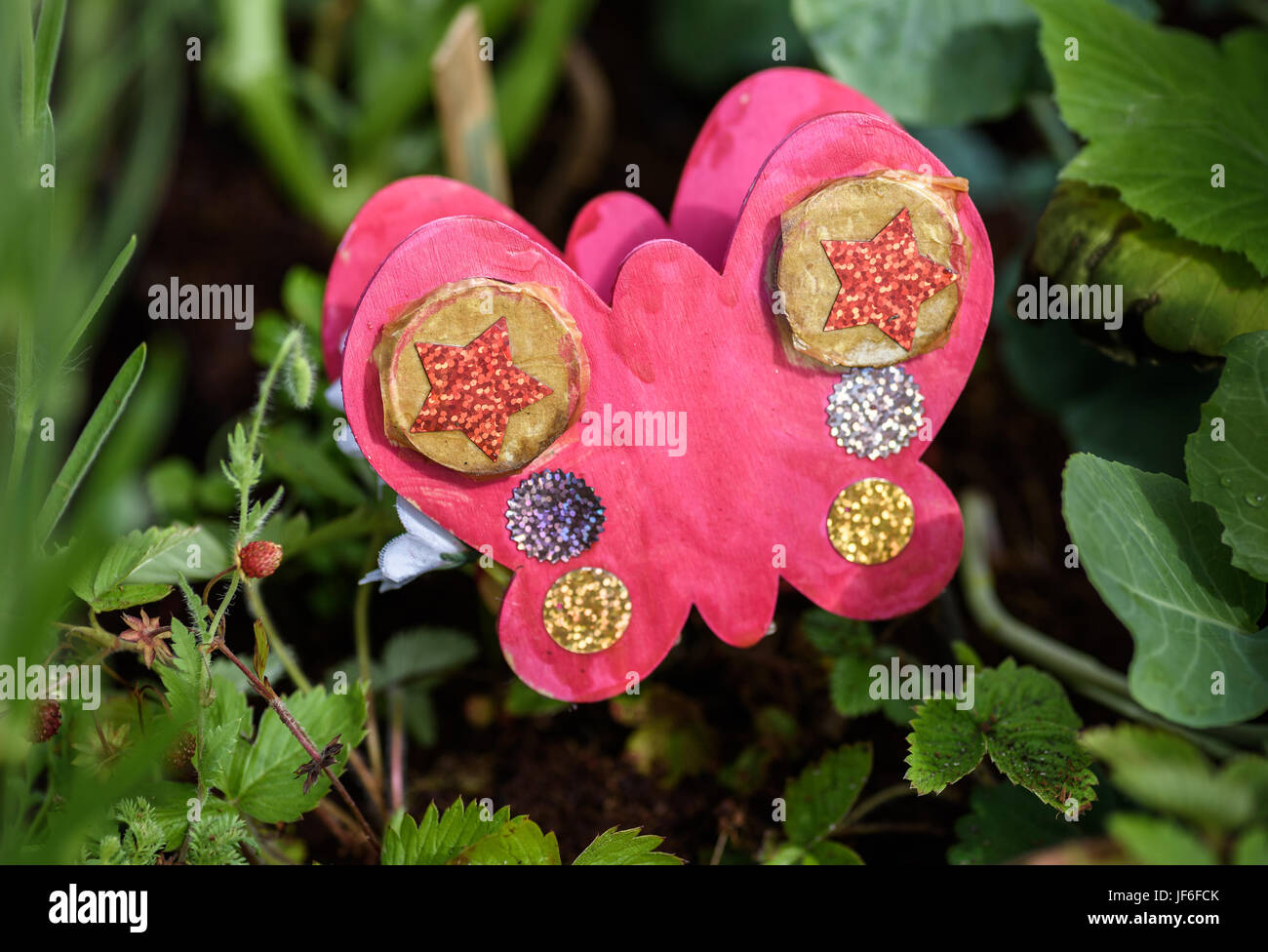 Handmade paper butterfly in a garden Stock Photo - Alamy
