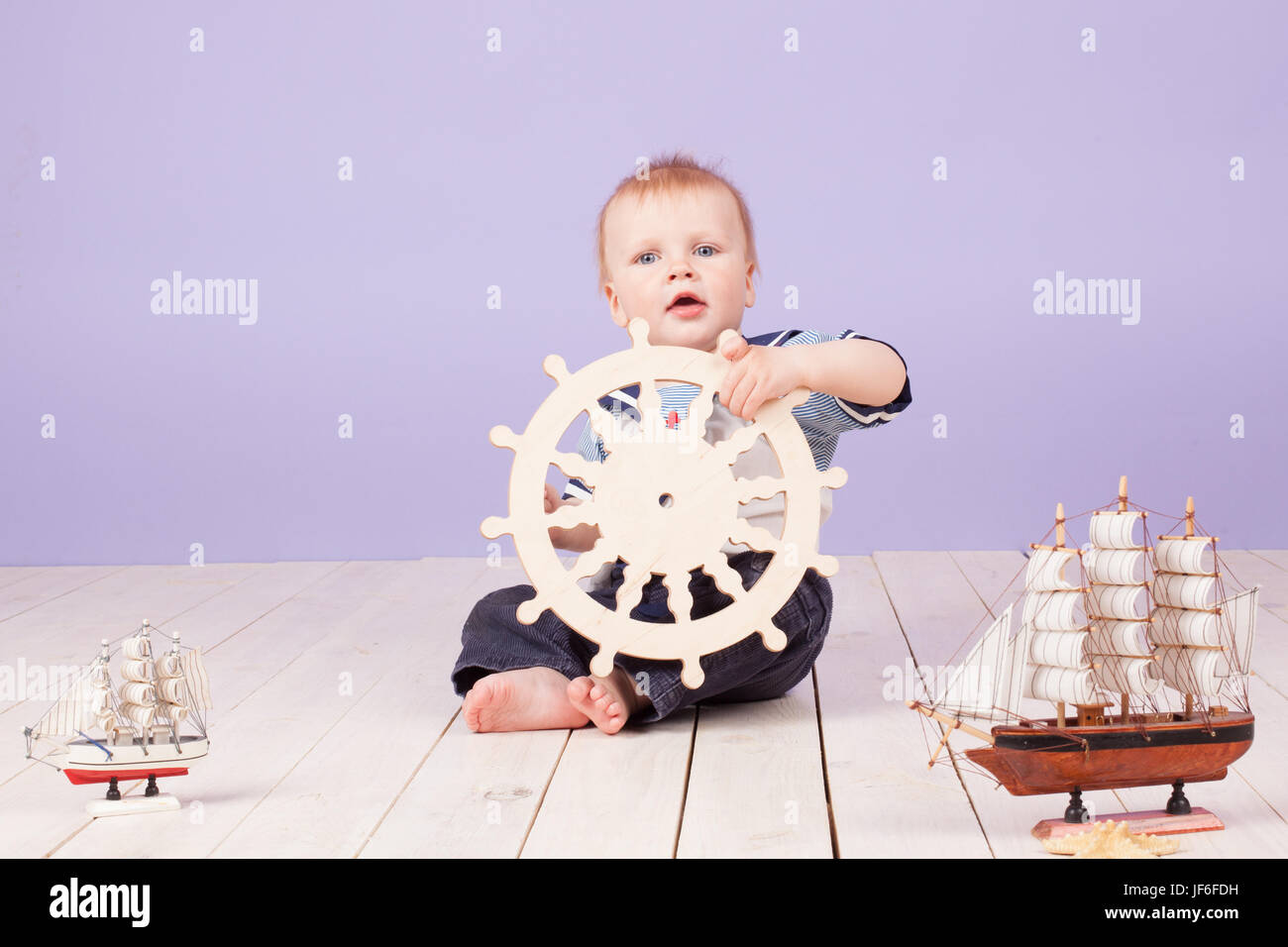 a little boy dressed as a sailor captain of ship Stock Photo - Alamy