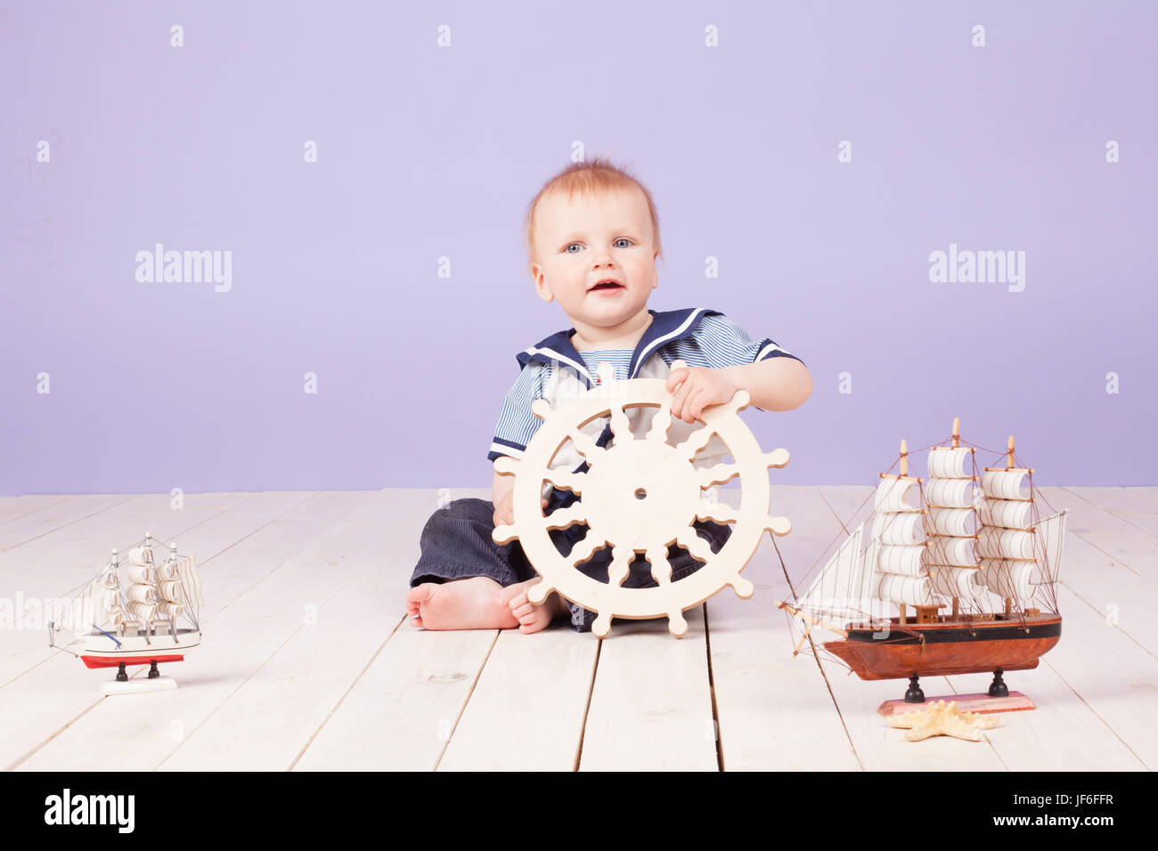 a little boy dressed as a sailor captain of ship Stock Photo - Alamy