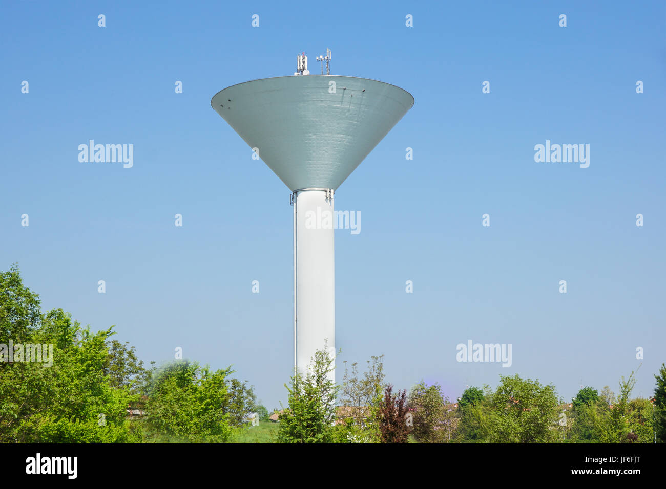 concrete modern water tower against blue sky Stock Photo - Alamy