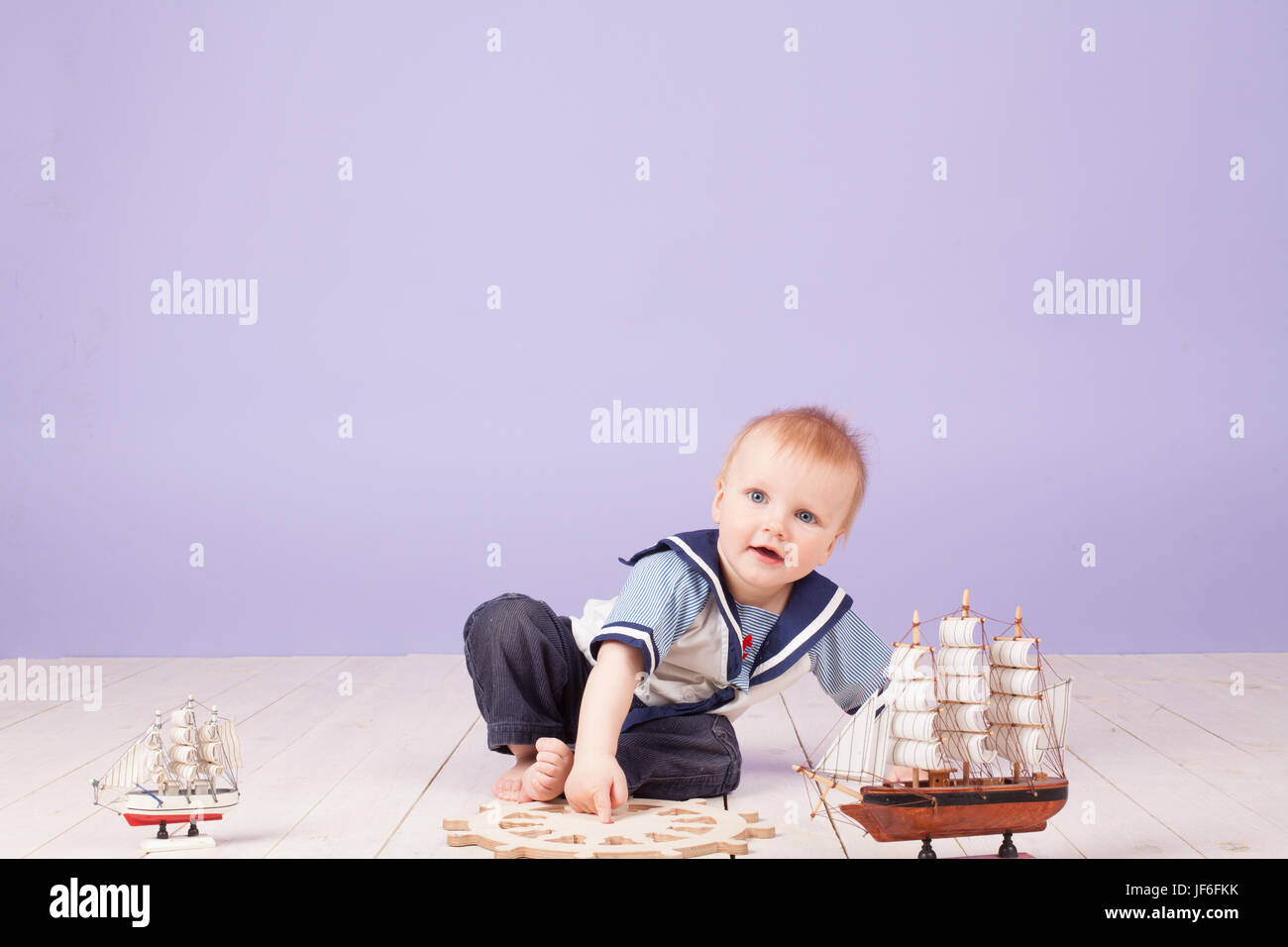 a little boy dressed as a sailor captain of ship Stock Photo - Alamy