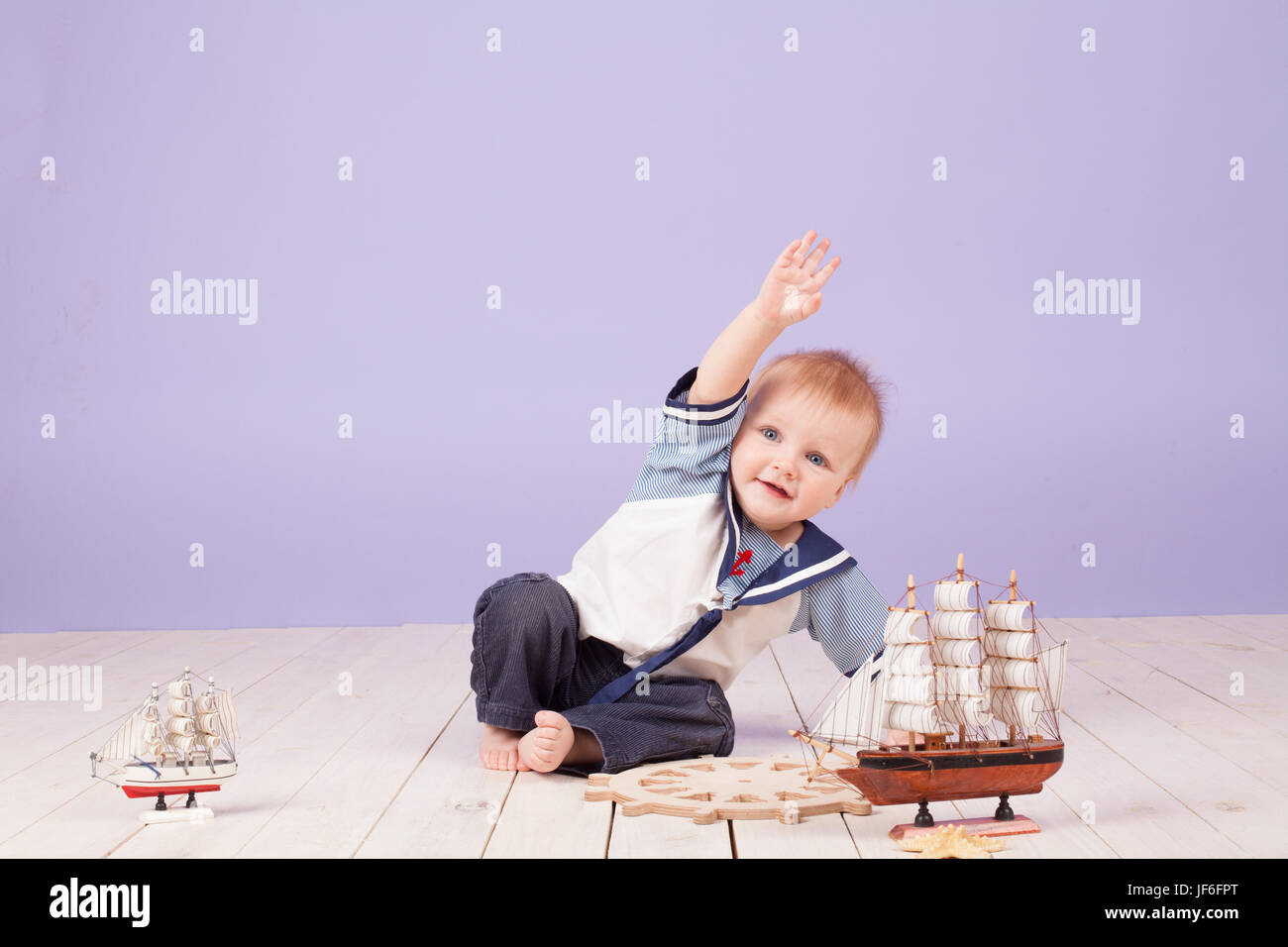a little boy dressed as a sailor captain of ship Stock Photo - Alamy