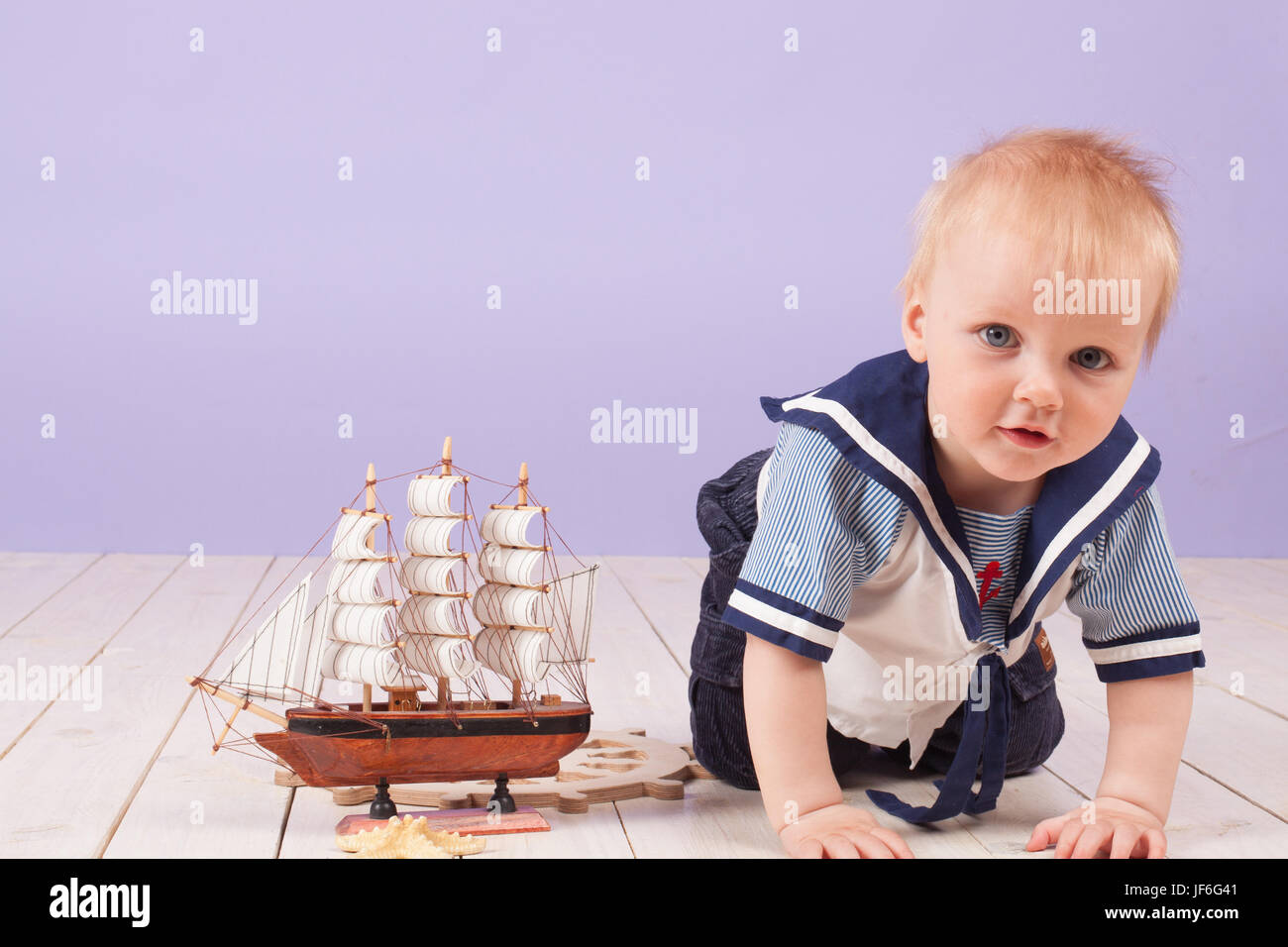 a little boy dressed as a sailor captain of ship Stock Photo - Alamy