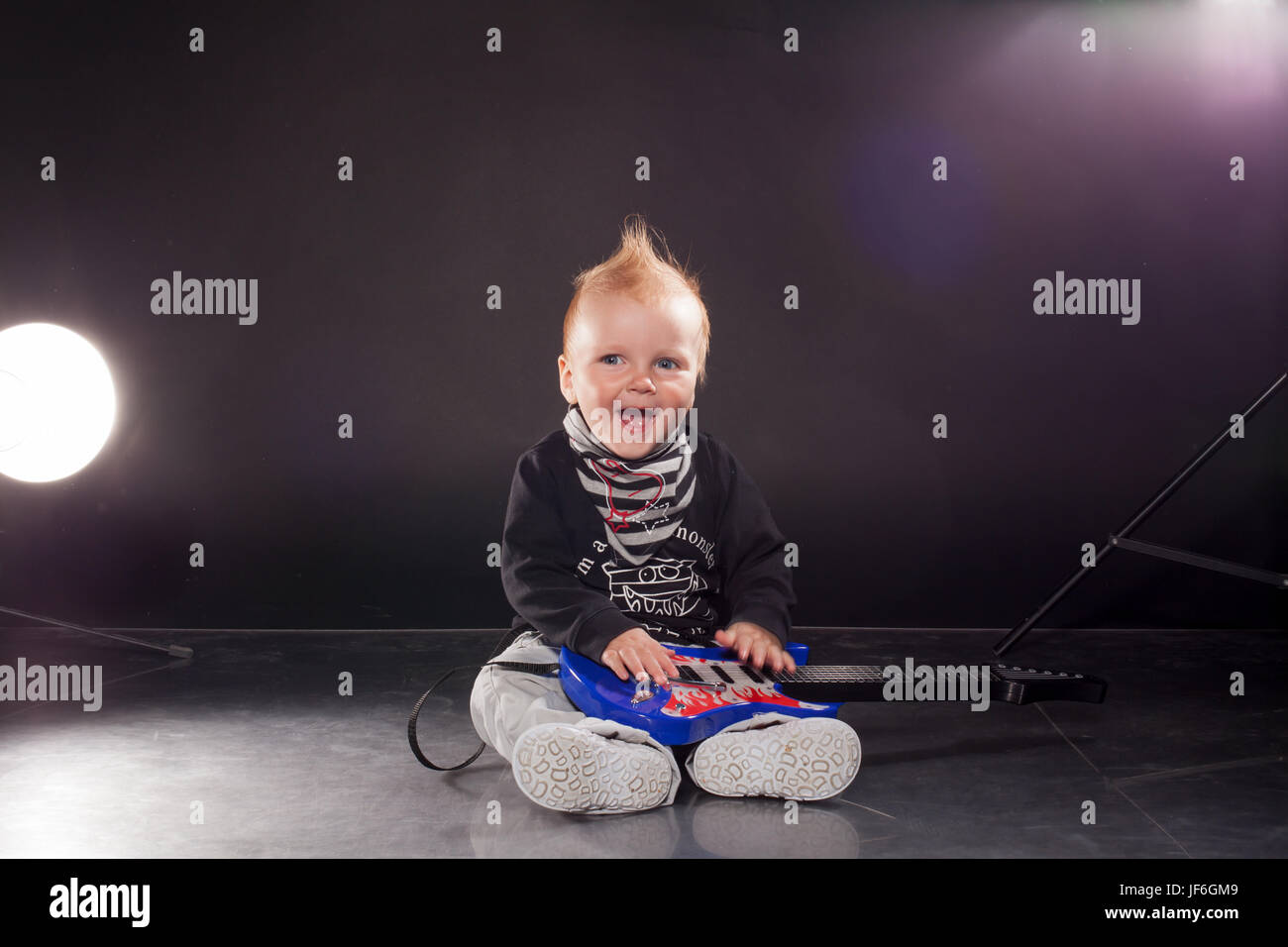 little boy musician playing rock music on the guitar Stock Photo - Alamy