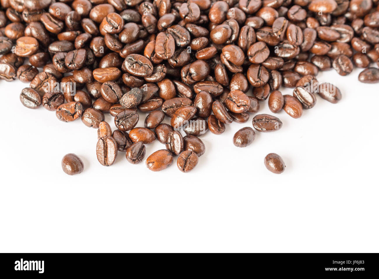 coffee beans close up on white background Stock Photo - Alamy