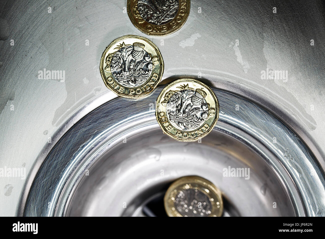 English Money Going Down Drain High Resolution Stock Photography and ...