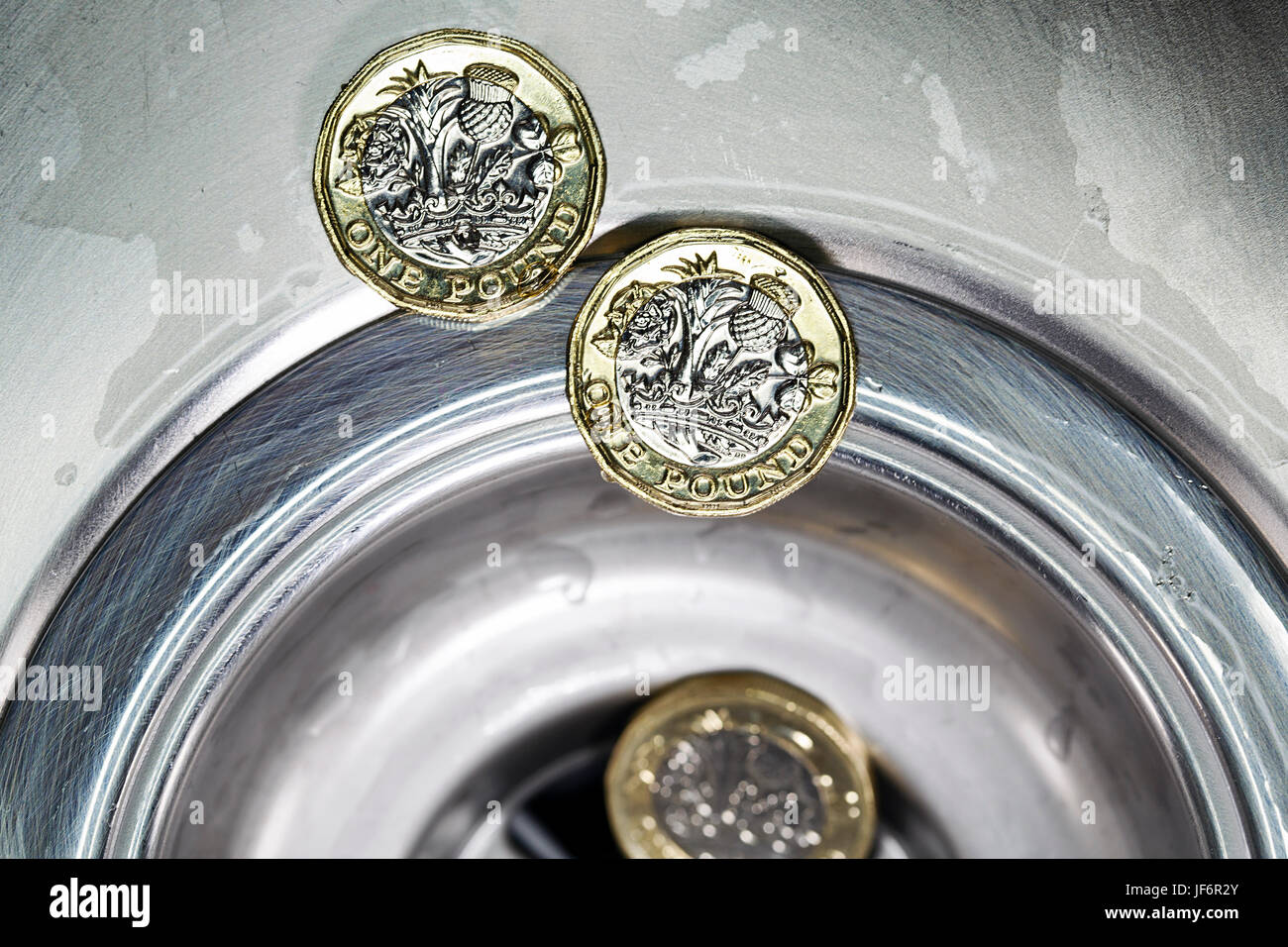 Money down the drain uk hi-res stock photography and images - Alamy