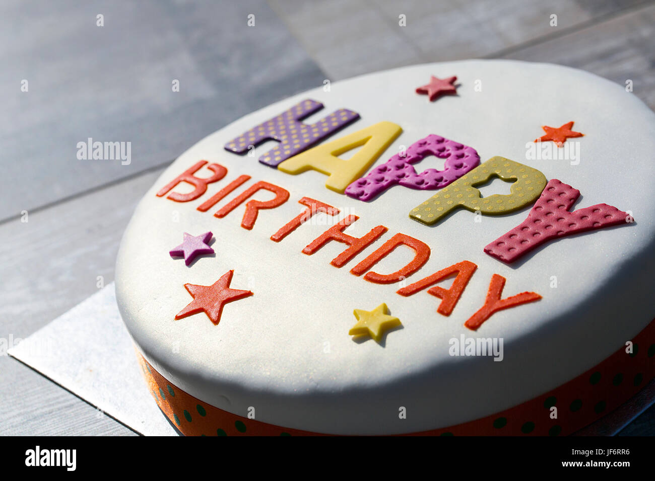 Birthday Cake with Icing Stock Photo - Alamy
