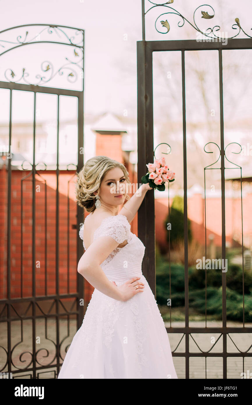 Beautiful bride woman portrait with bridal bouquet posing in her ...