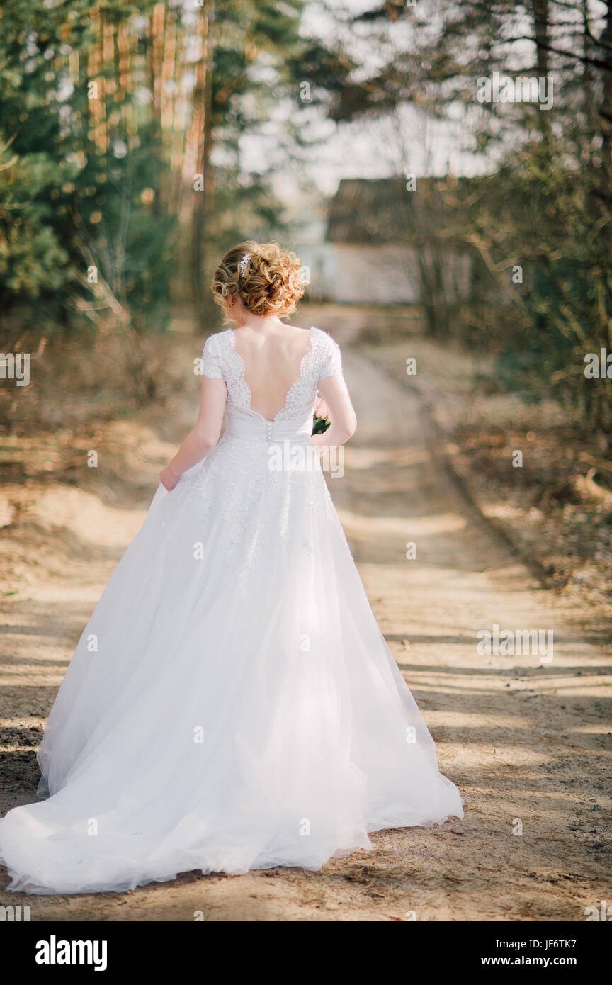Beautiful bride woman portrait with bridal bouquet posing in her ...
