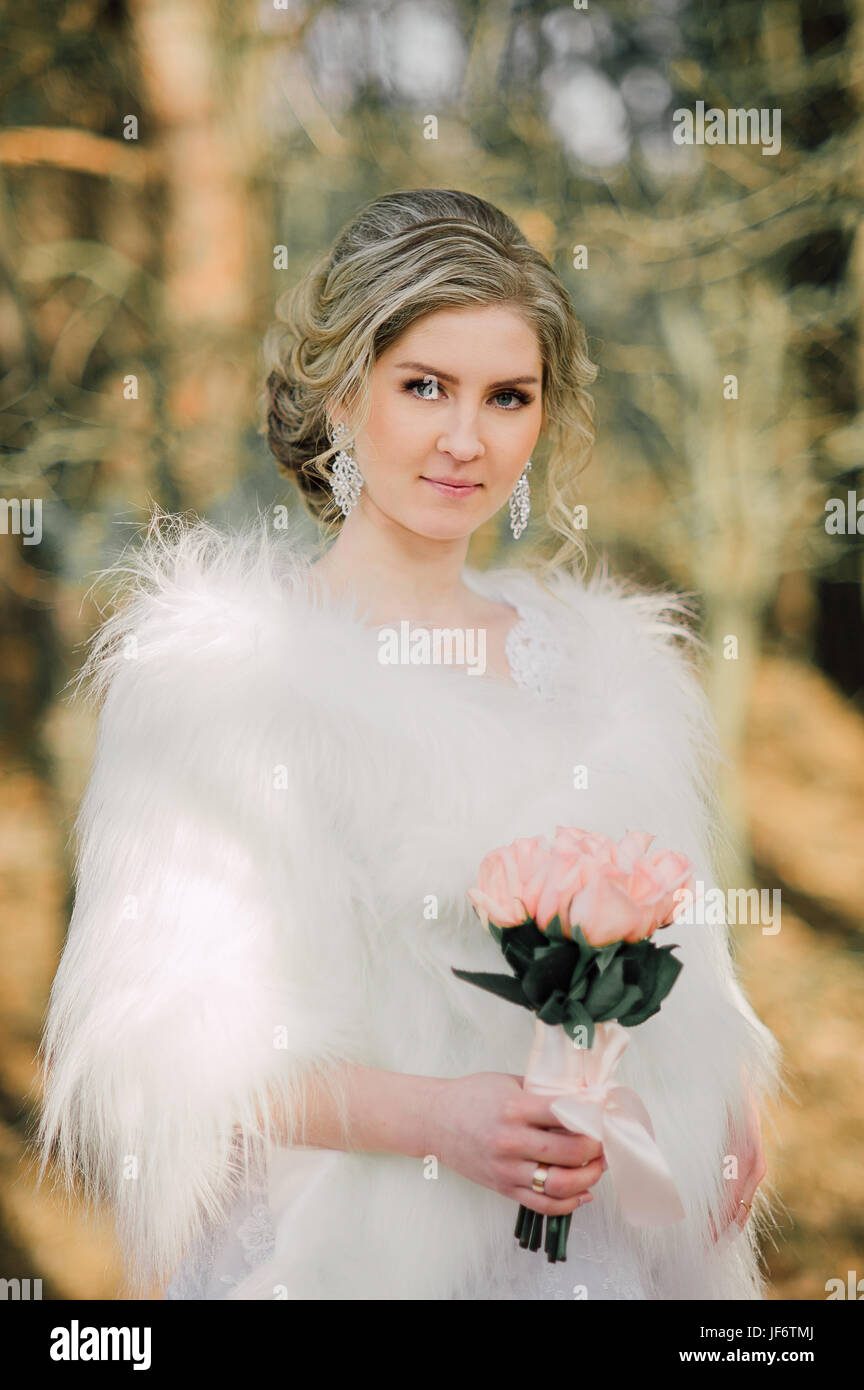 Beautiful bride woman portrait with bridal bouquet posing in her ...