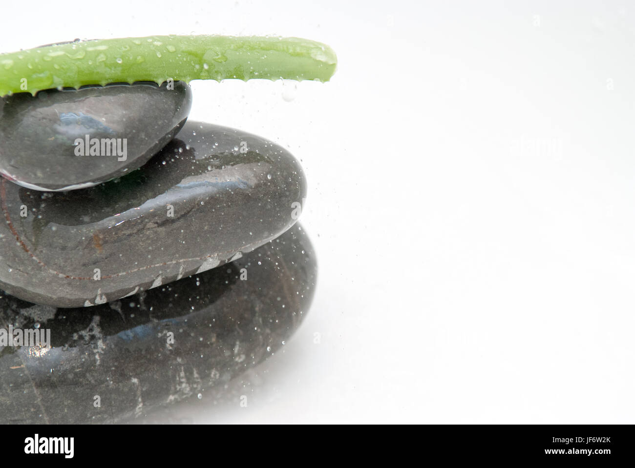 Spa treatment background of pebbles and running water with natural ...