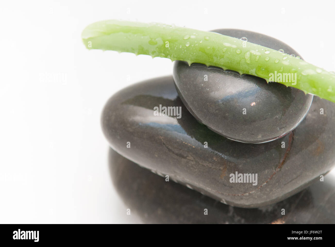 Spa treatment background of pebbles and running water with natural ...