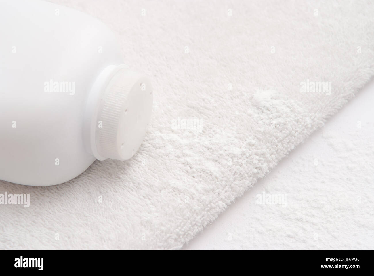 talcum powder on a soft white towel background Stock Photo - Alamy
